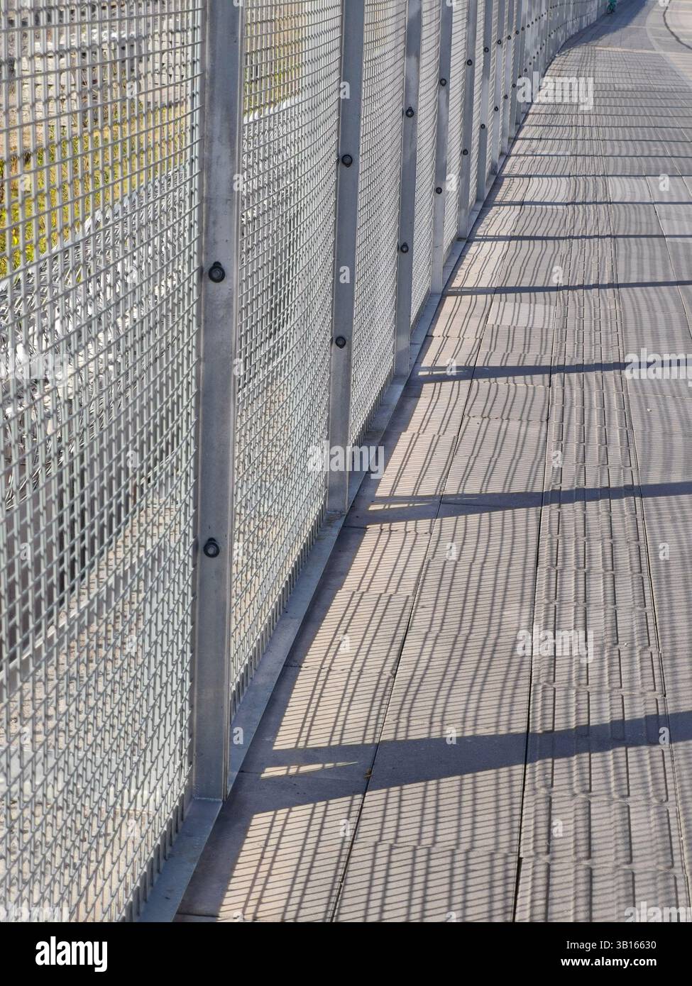 Wire mesh with road background Stock Photo - Alamy