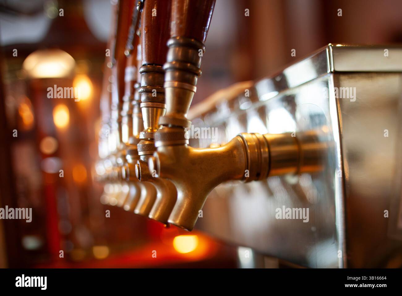 Brass beer taps with wood handles at brewery Stock Photo - Alamy