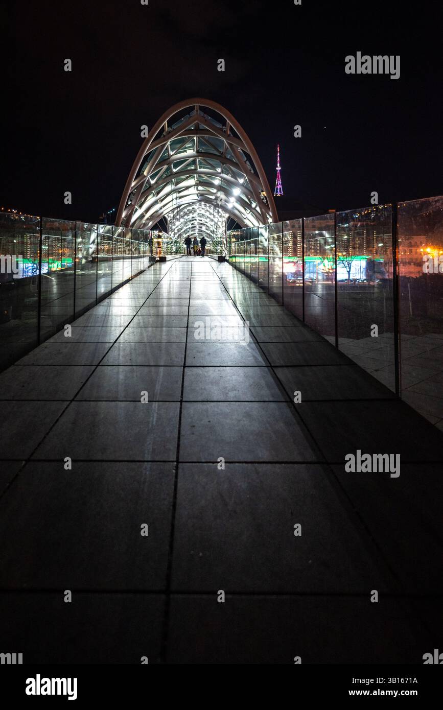 Peace bridge, steel and glass construction pedestrian bridge over Kura ...