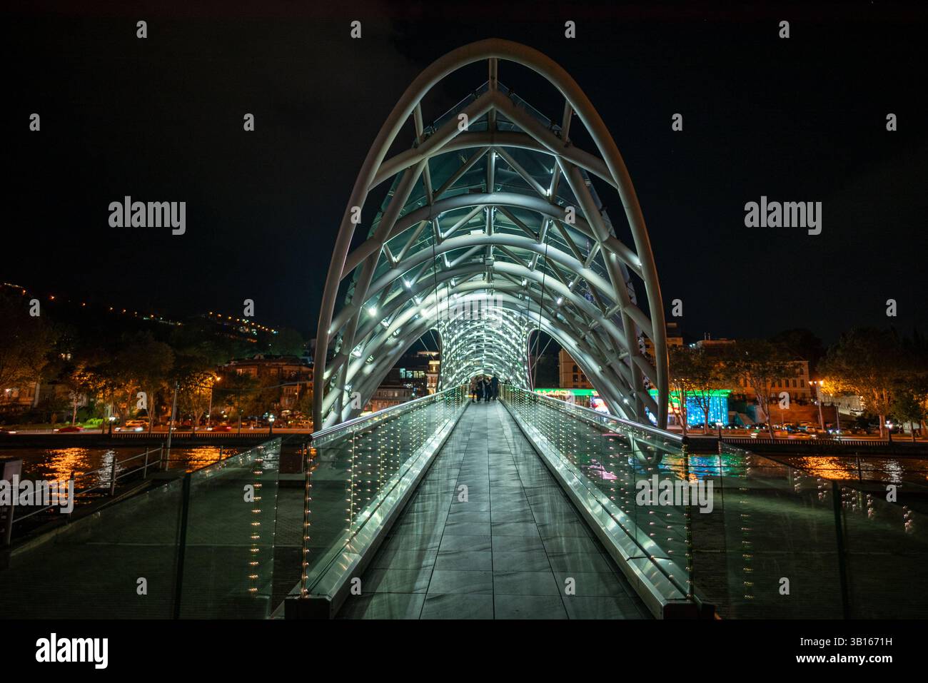 Peace bridge, steel and glass construction pedestrian bridge over Kura ...