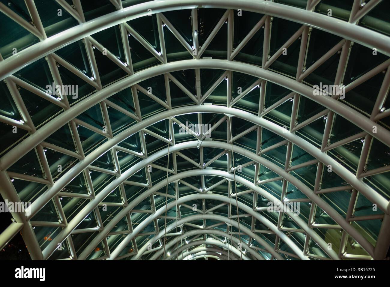 Peace bridge, steel and glass construction pedestrian bridge over Kura ...