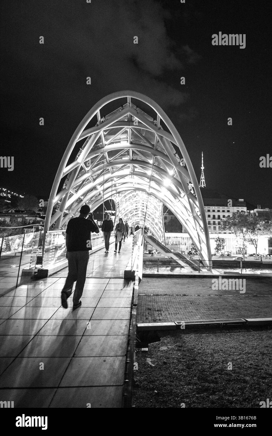 Peace bridge, steel and glass construction pedestrian bridge over Kura ...