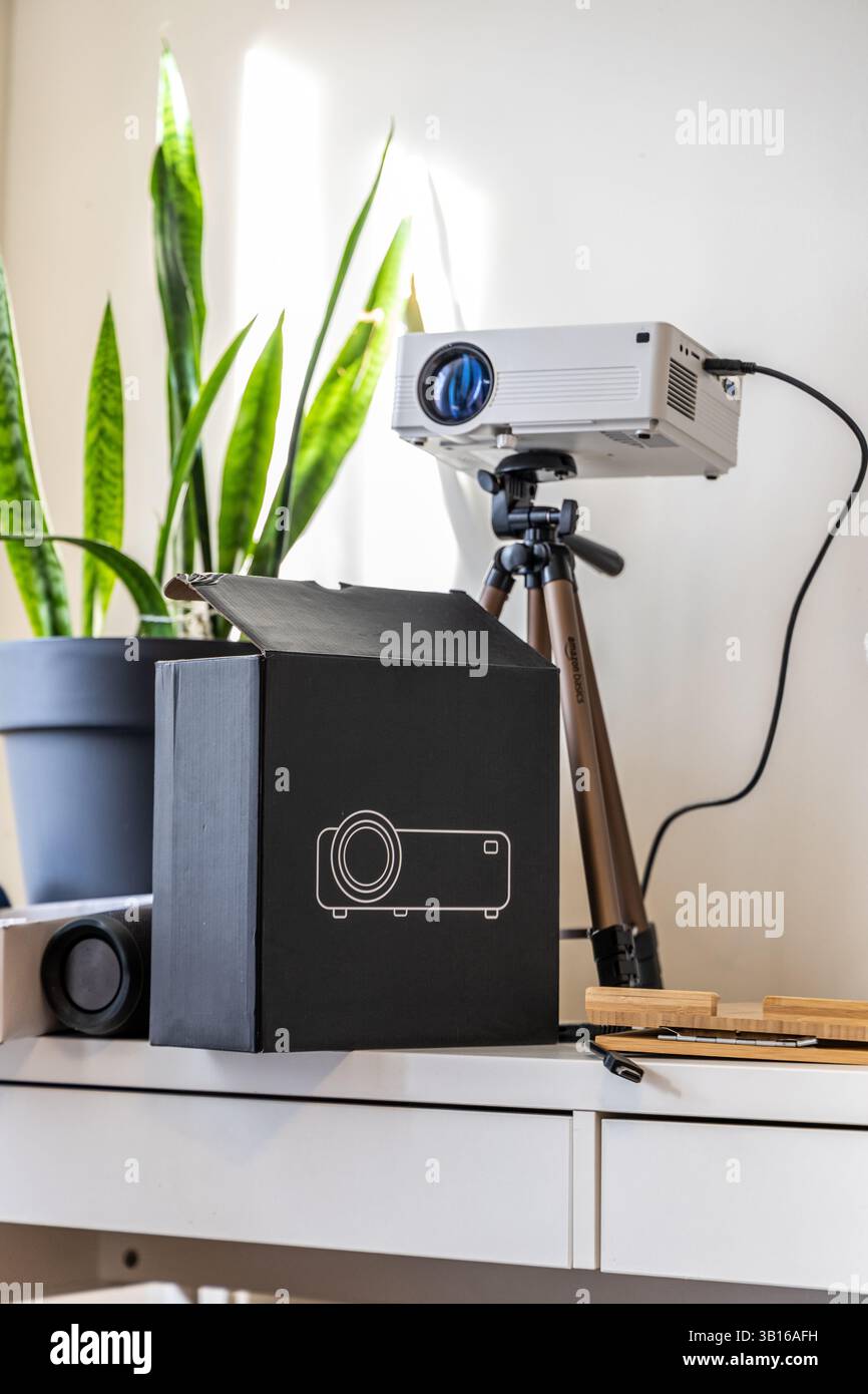 White 4K compact home projector. small and high quality Stock Photo - Alamy