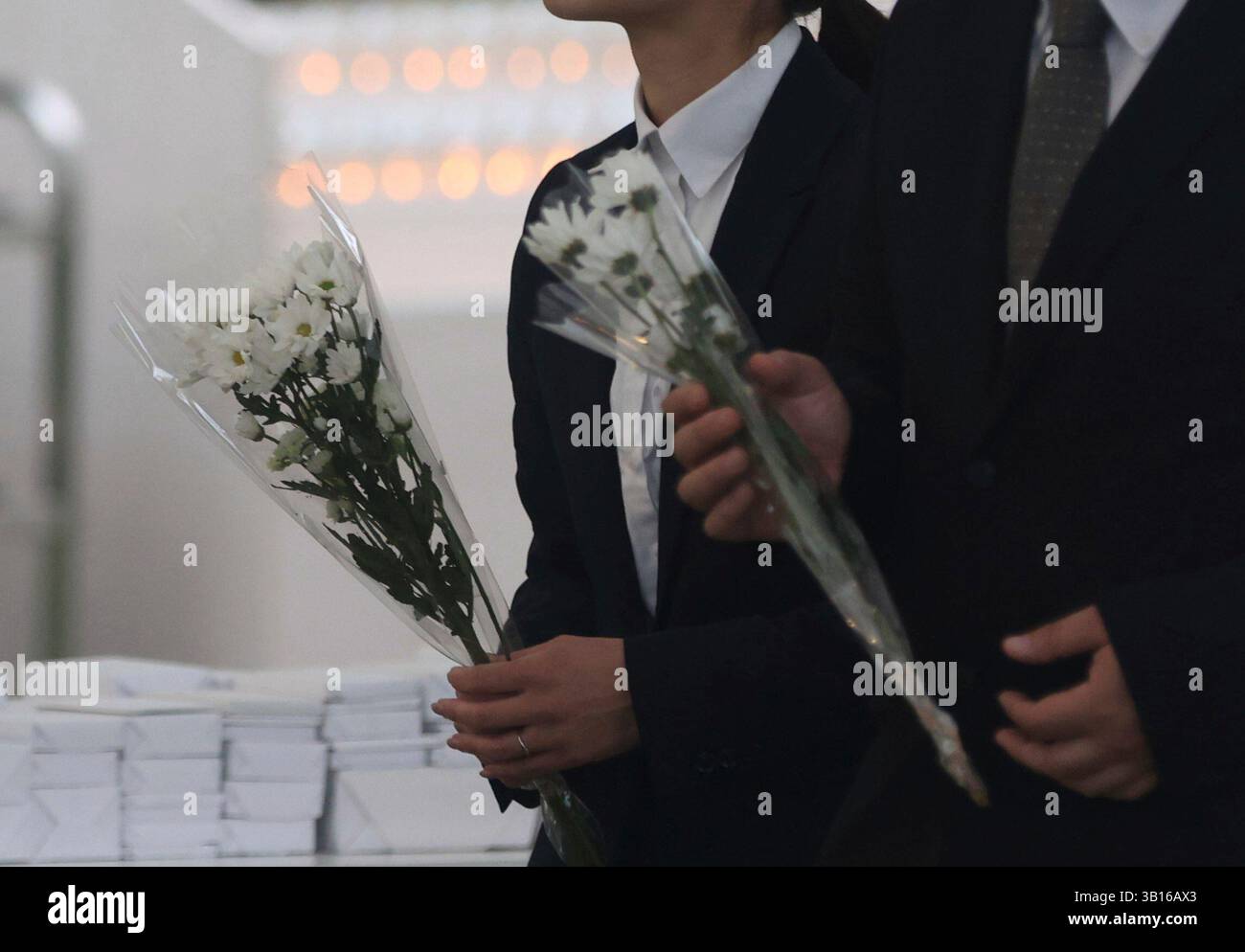 A memorial ceremony for the victims of a train derailment accident is held at the memorial ...