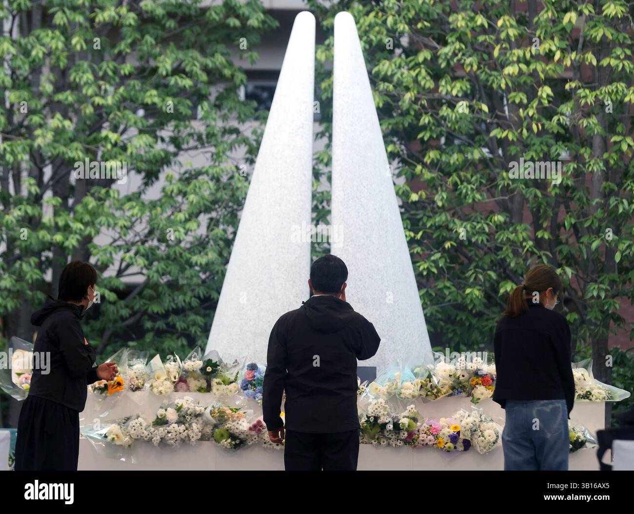 A memorial ceremony for the victims of a train derailment accident is held at the memorial ...