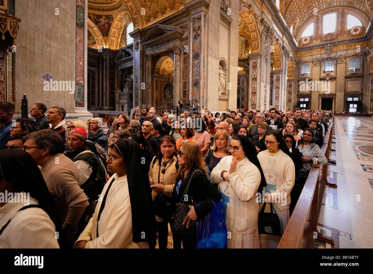 People wait in lines to pay their respects to the late Pope Francis ...