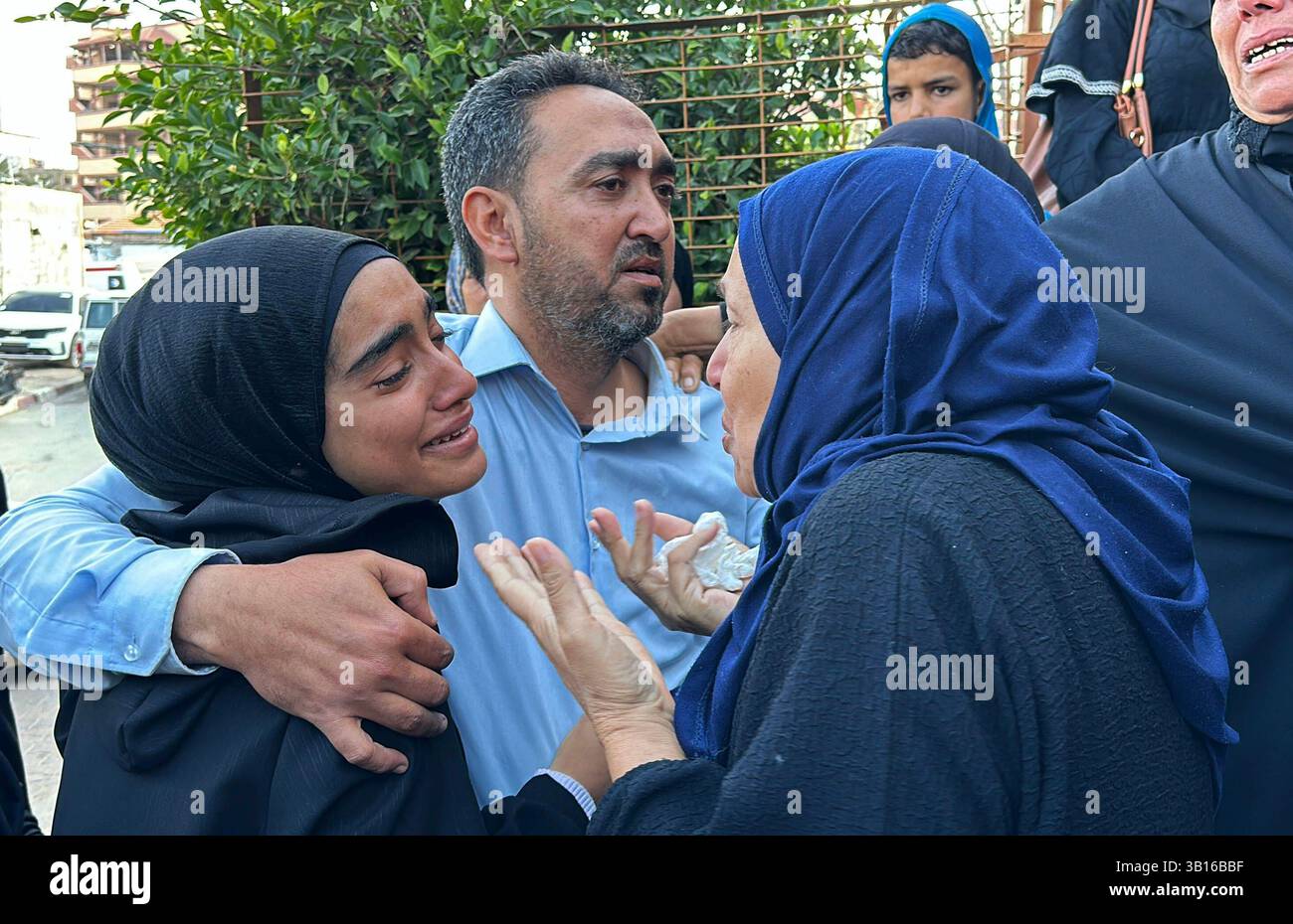 Palestinians gather next to the bodies of Abu Taima family killed in ...