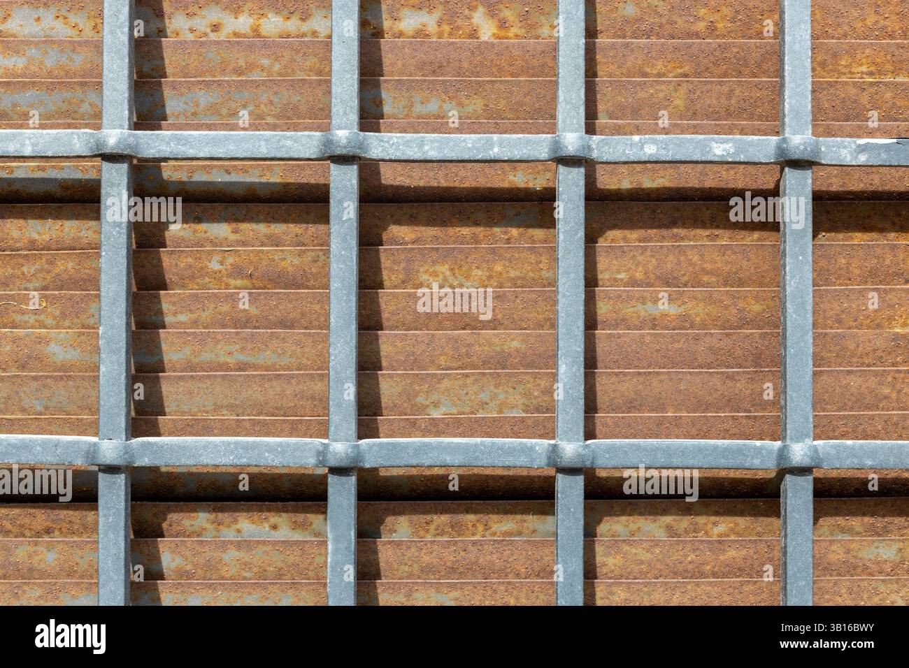 Galvanized Grid on Rusted Metal Surface Stock Photo - Alamy