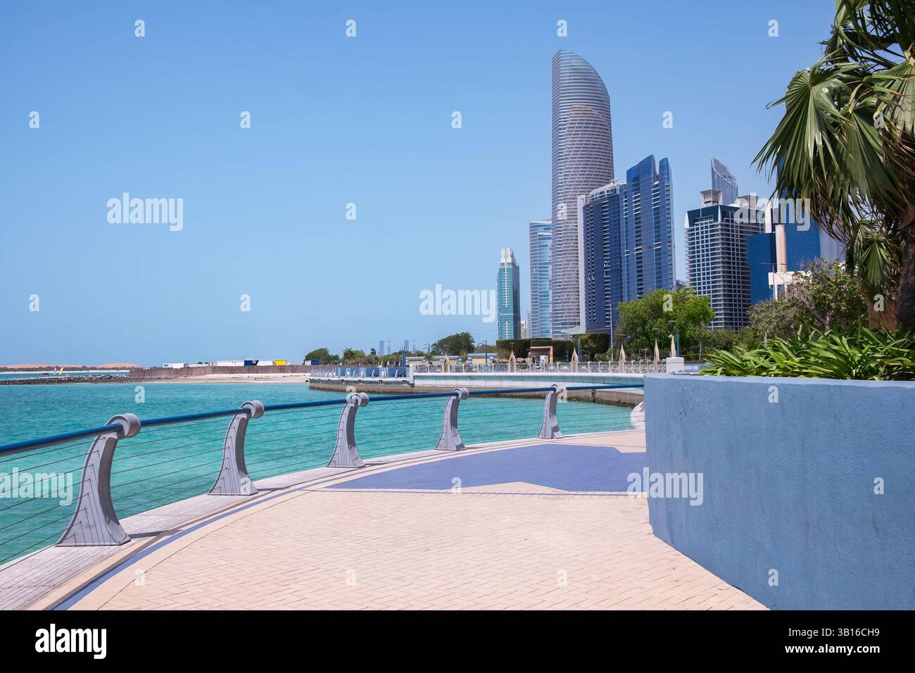 Beautiful walkway in urban city park with green trees. View of the ...