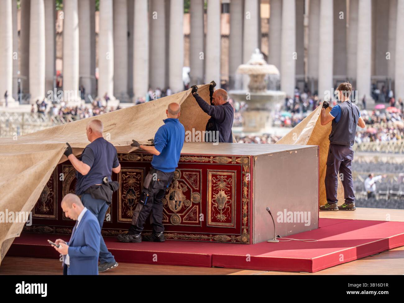 24 April 2025, Vatican, Vatican City: Workers prepare the altar for the ...