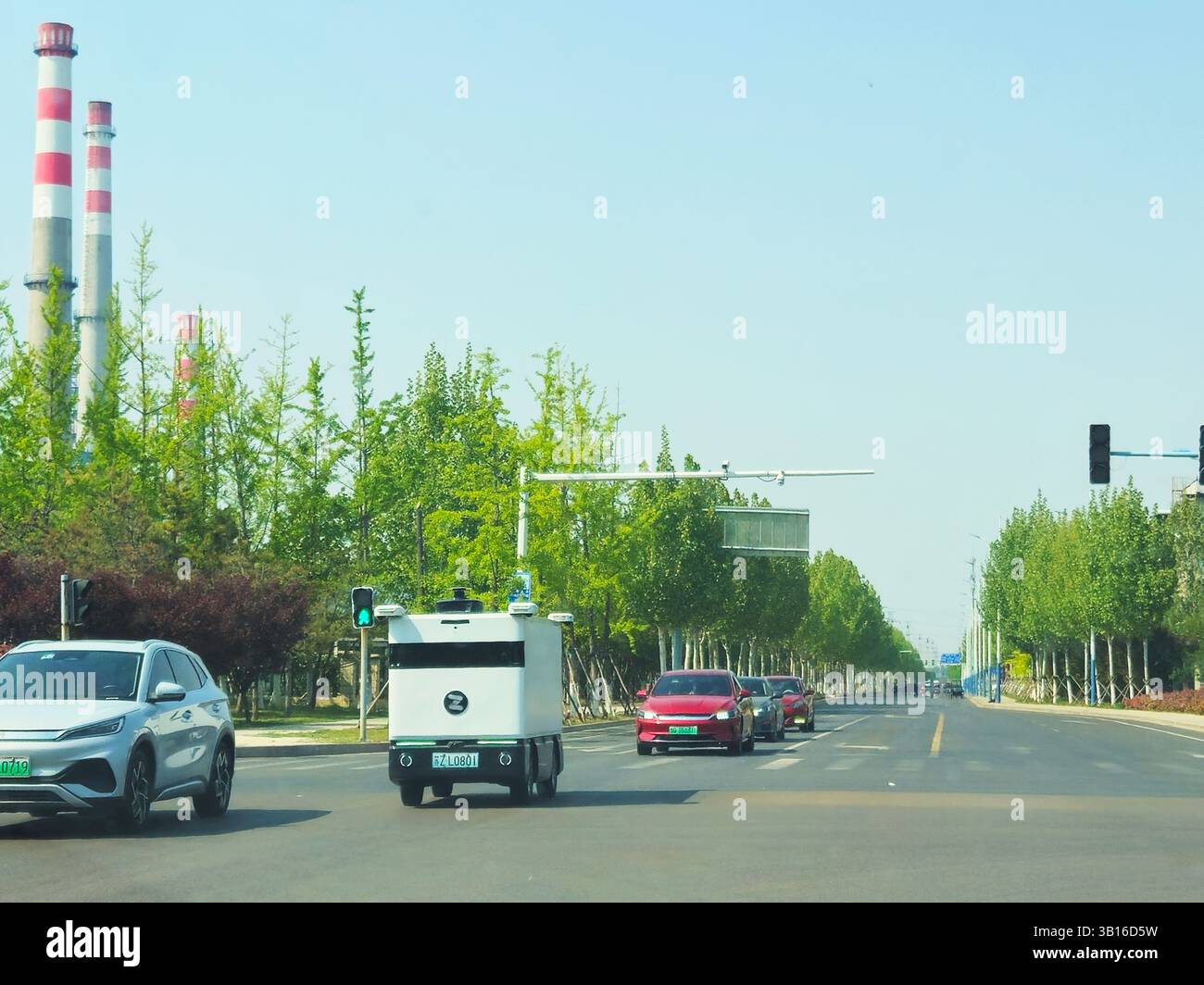 Autonomous Delivery Vehicle Navigating Urban Traffic Among Electric ...