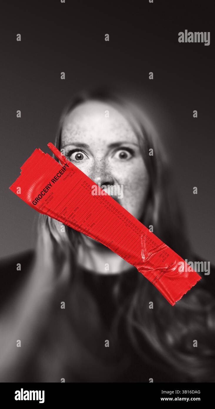 Angry woman with long red grocery receipt covering her mouth, with ...