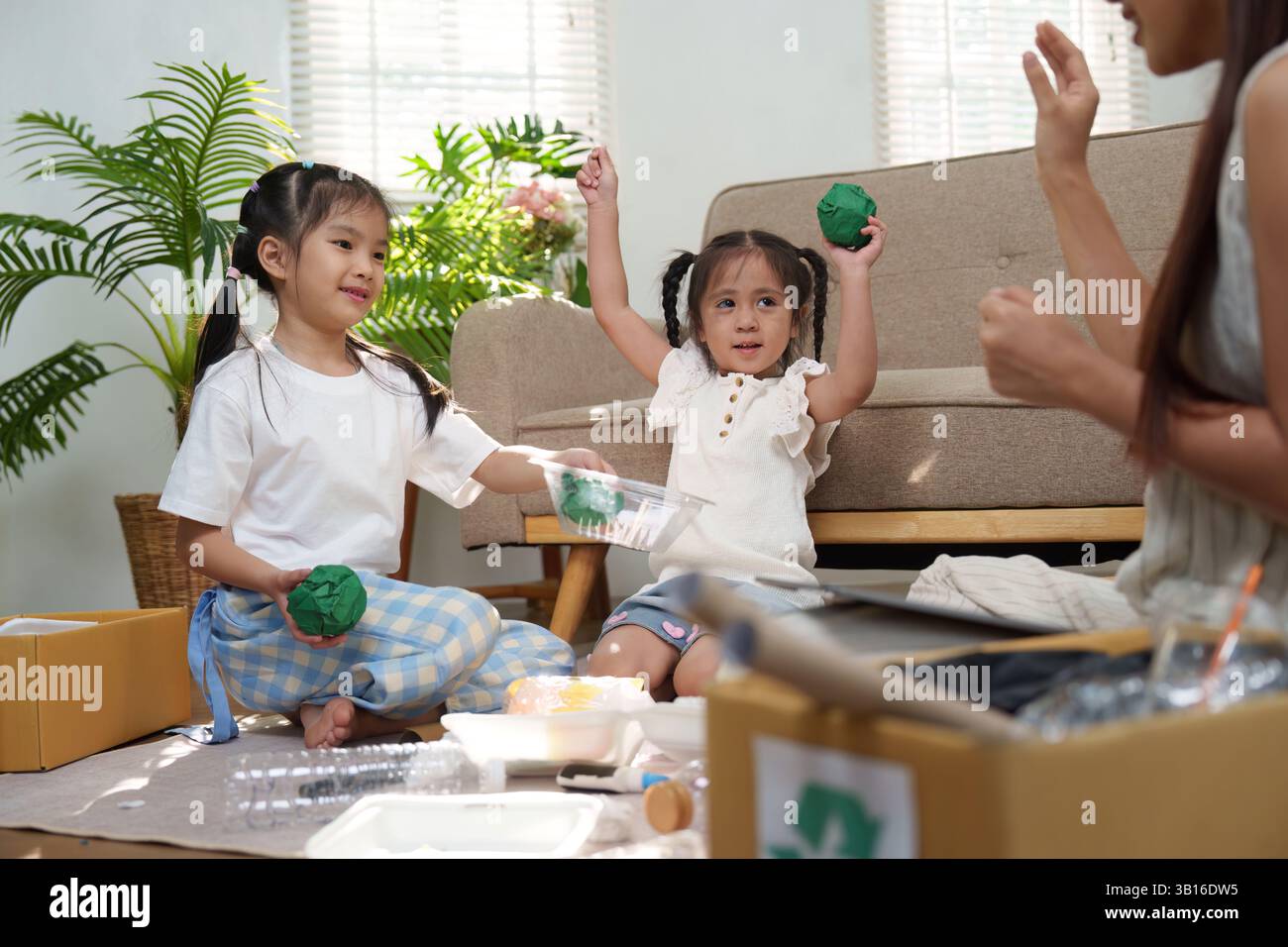 Joy and Creativity in Recycling. Kids celebrating their crafting ...