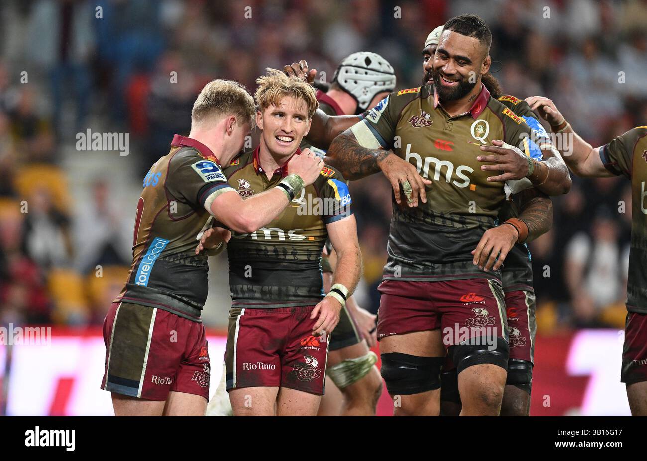 Tate McDermott of the Reds celebrates after scoring a try during the ...