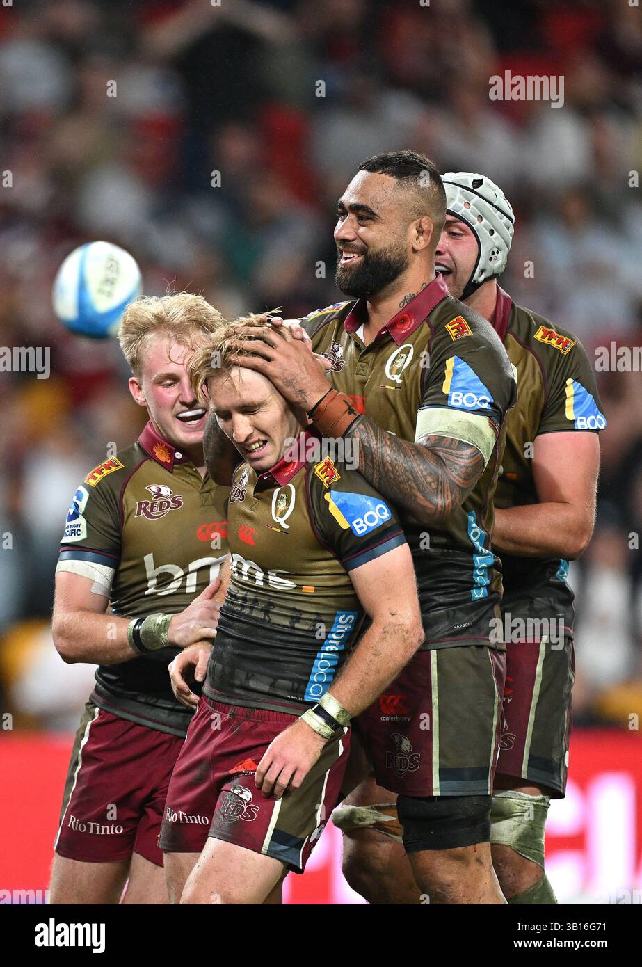 Tate McDermott of the Reds celebrates after scoring a try during the ...