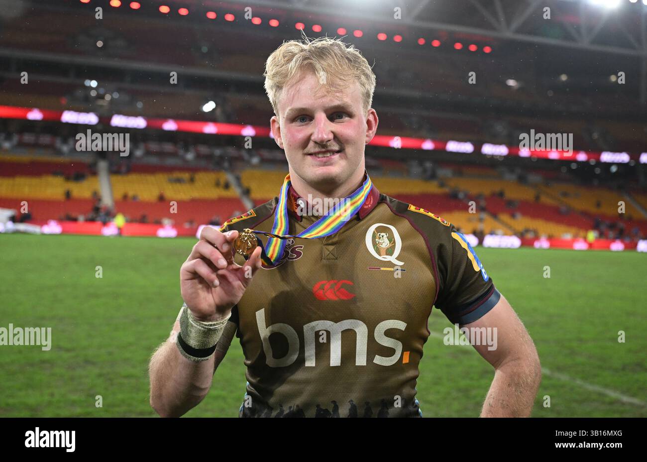 Tom Lynagh of the Reds poses for a photograph after winning the ...