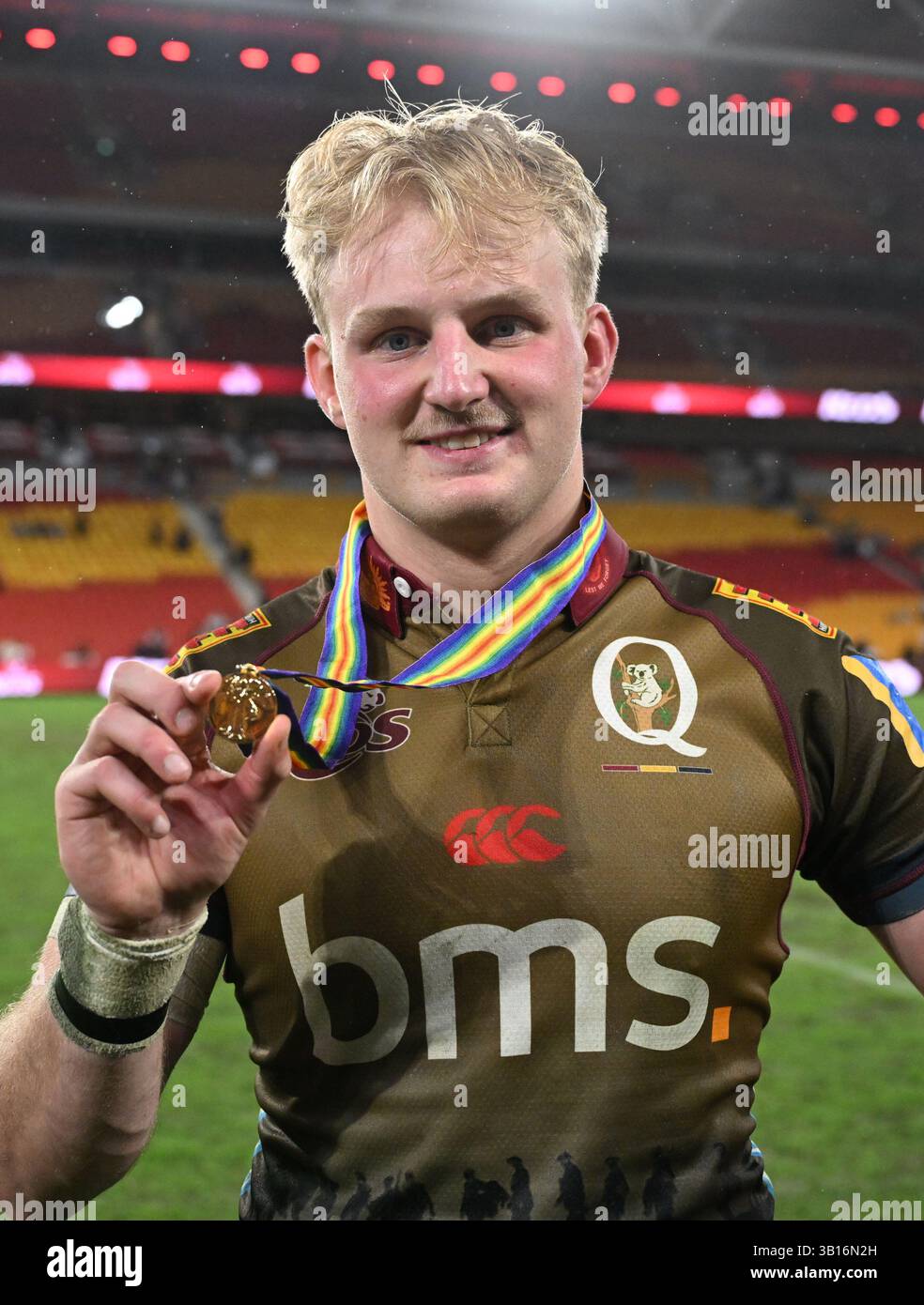 Tom Lynagh of the Reds poses for a photograph after winning the ...