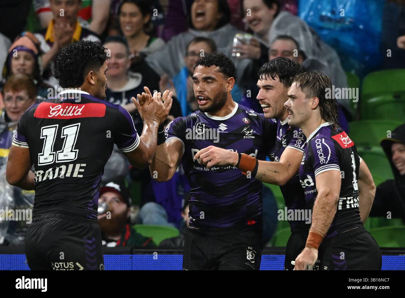 Xavier Coates of the Storm (centre) celebrates with teammates after ...