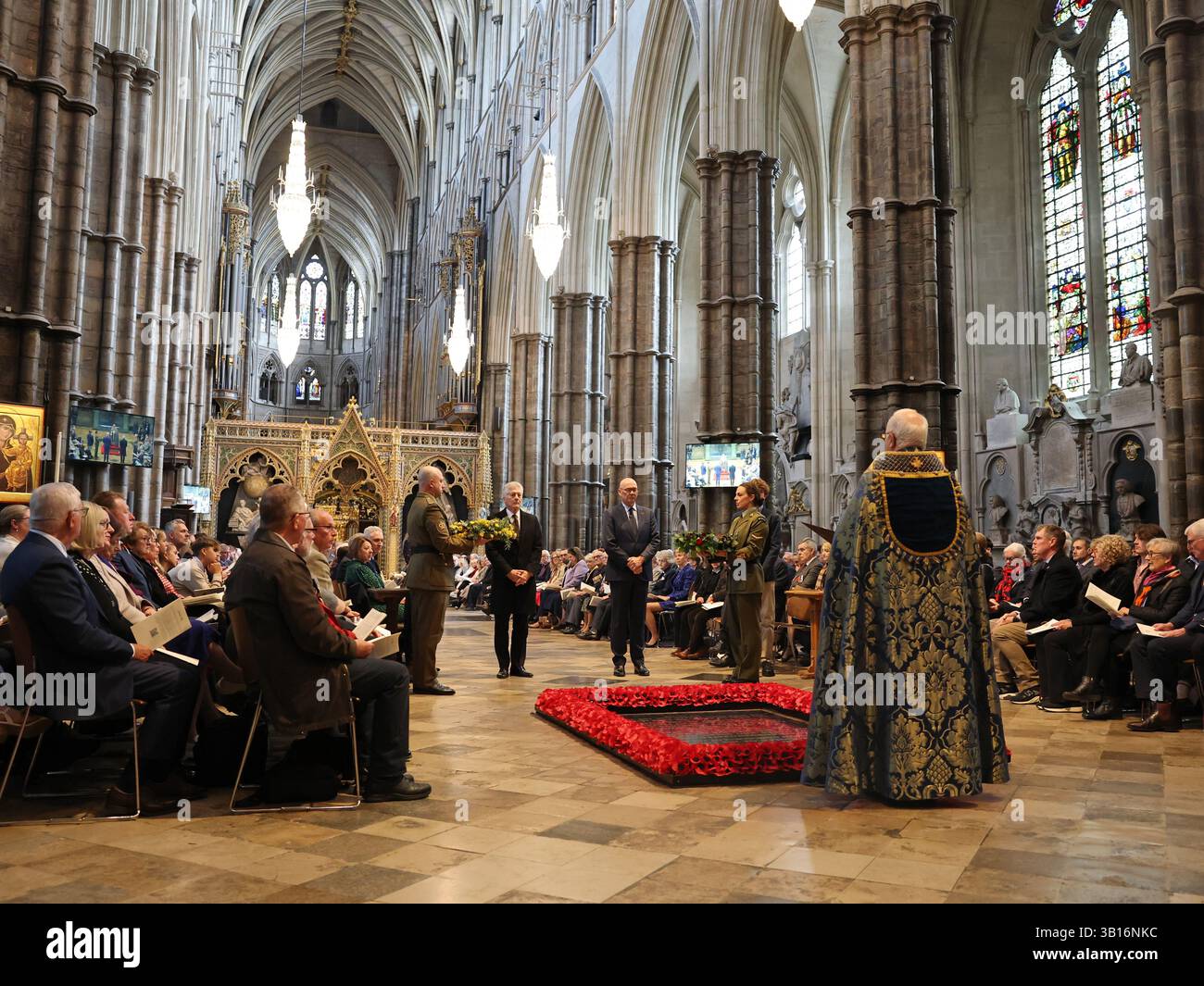 A moment of reflection is held during a service of commemoration and ...