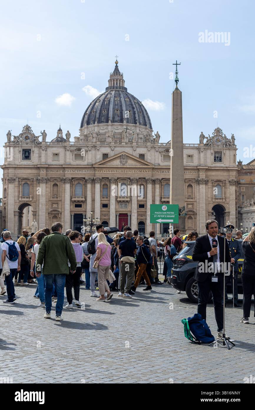 Vatican - April, 23, 2025: Reporter holding mic in front of crowd and ...