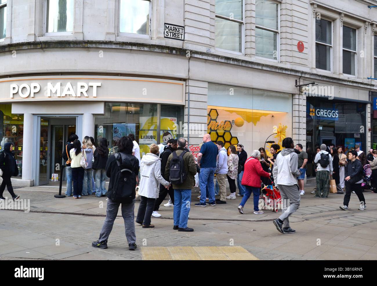 Manchester, UK, 25th April, 2025. A large queue formed at the Pop Mart ...