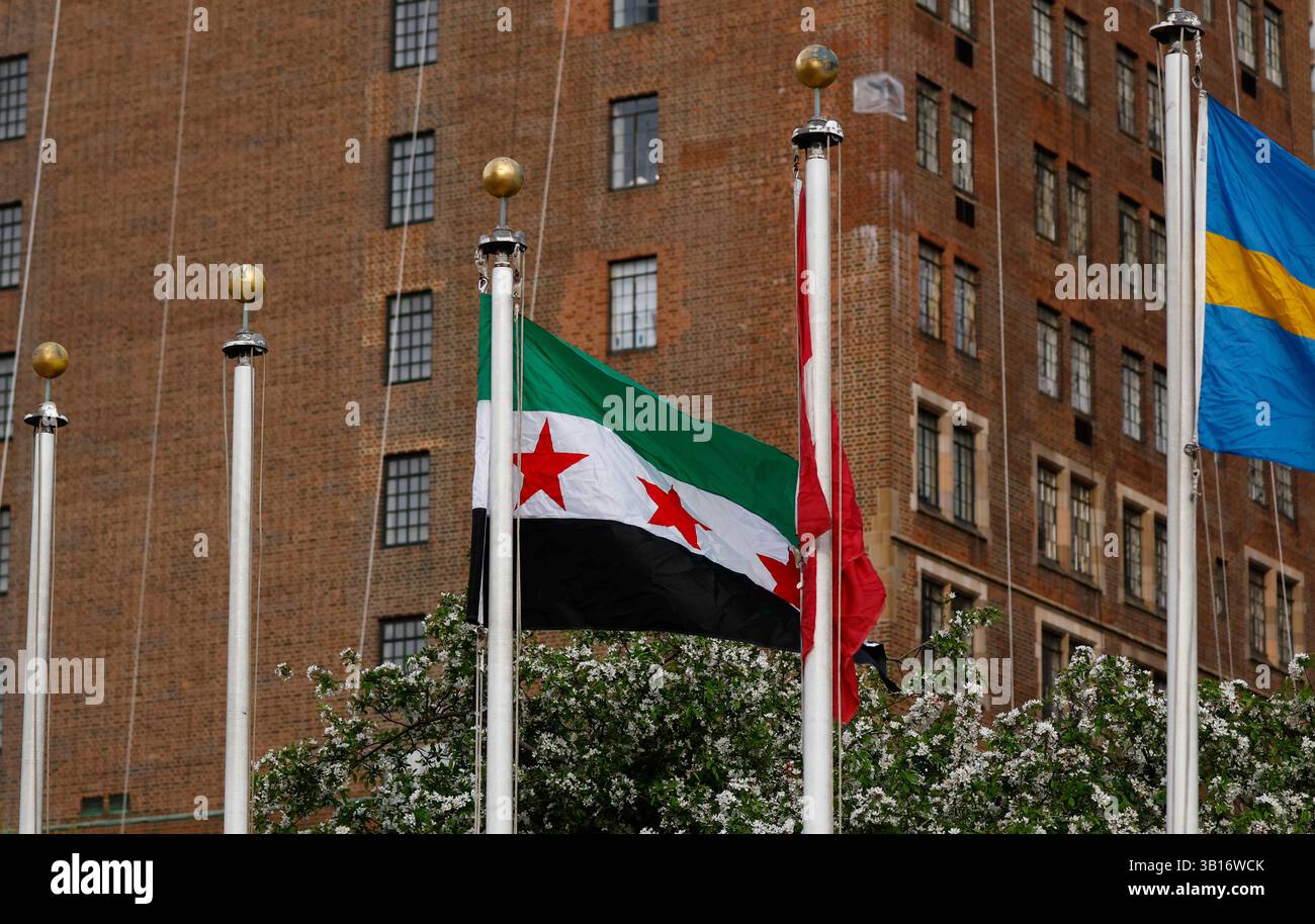 The Syrian Flag is raised during a ceremony where it was added to the ...