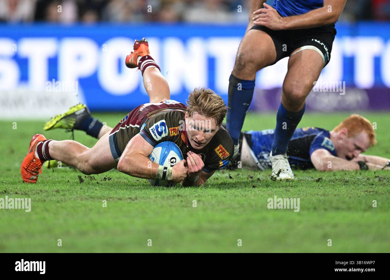 Brisbane, Australia. 25th Apr, 2025. Tate McDermott of the Reds scoring ...