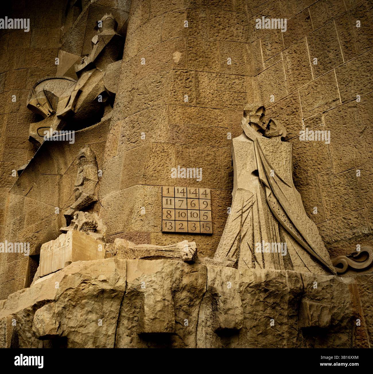 A detailed stone sculpture featuring abstract figures and geometric ...