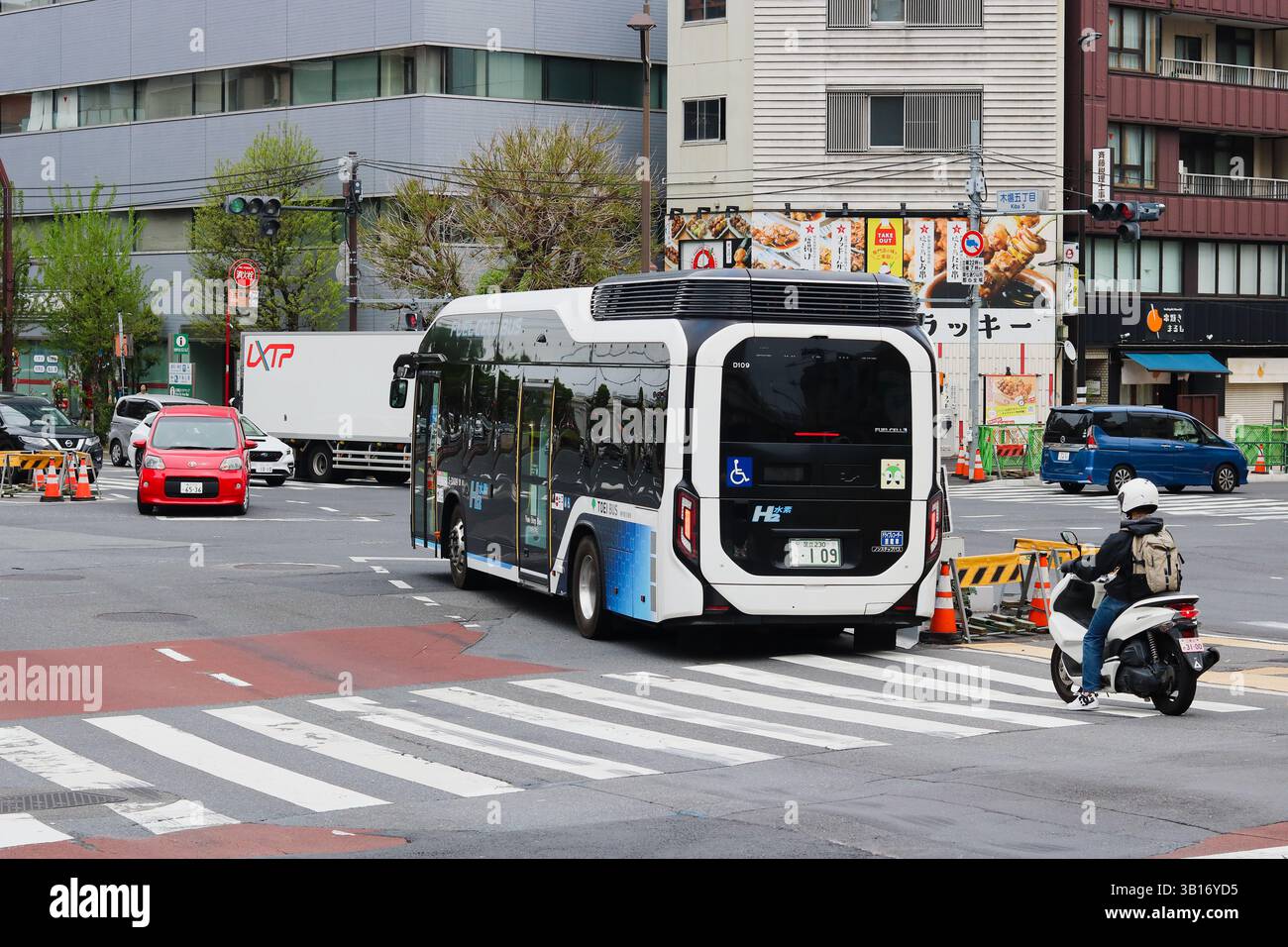 TOKYO, JAPAN - April 20, 2025: A hydrogen fuel cell bus on a junction ...