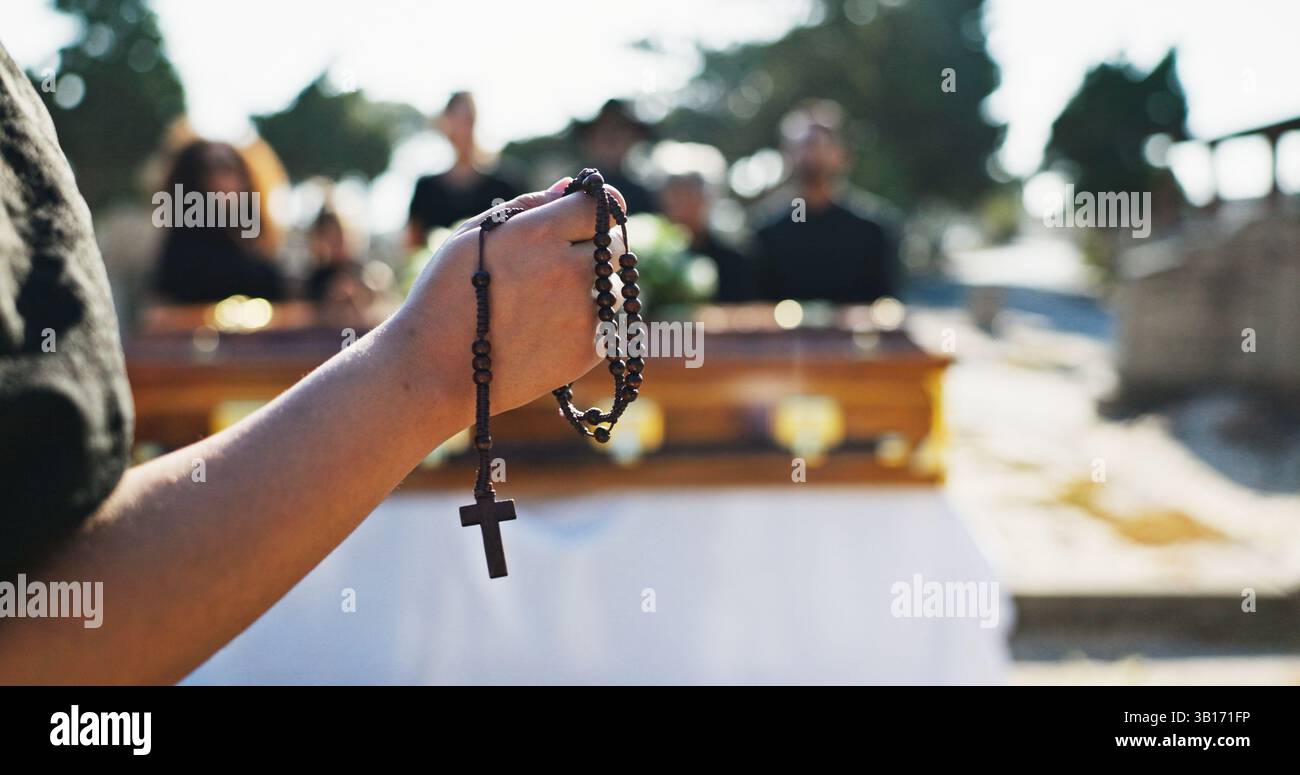 Funeral, hands and person with rosary, ceremony and symbol for ...