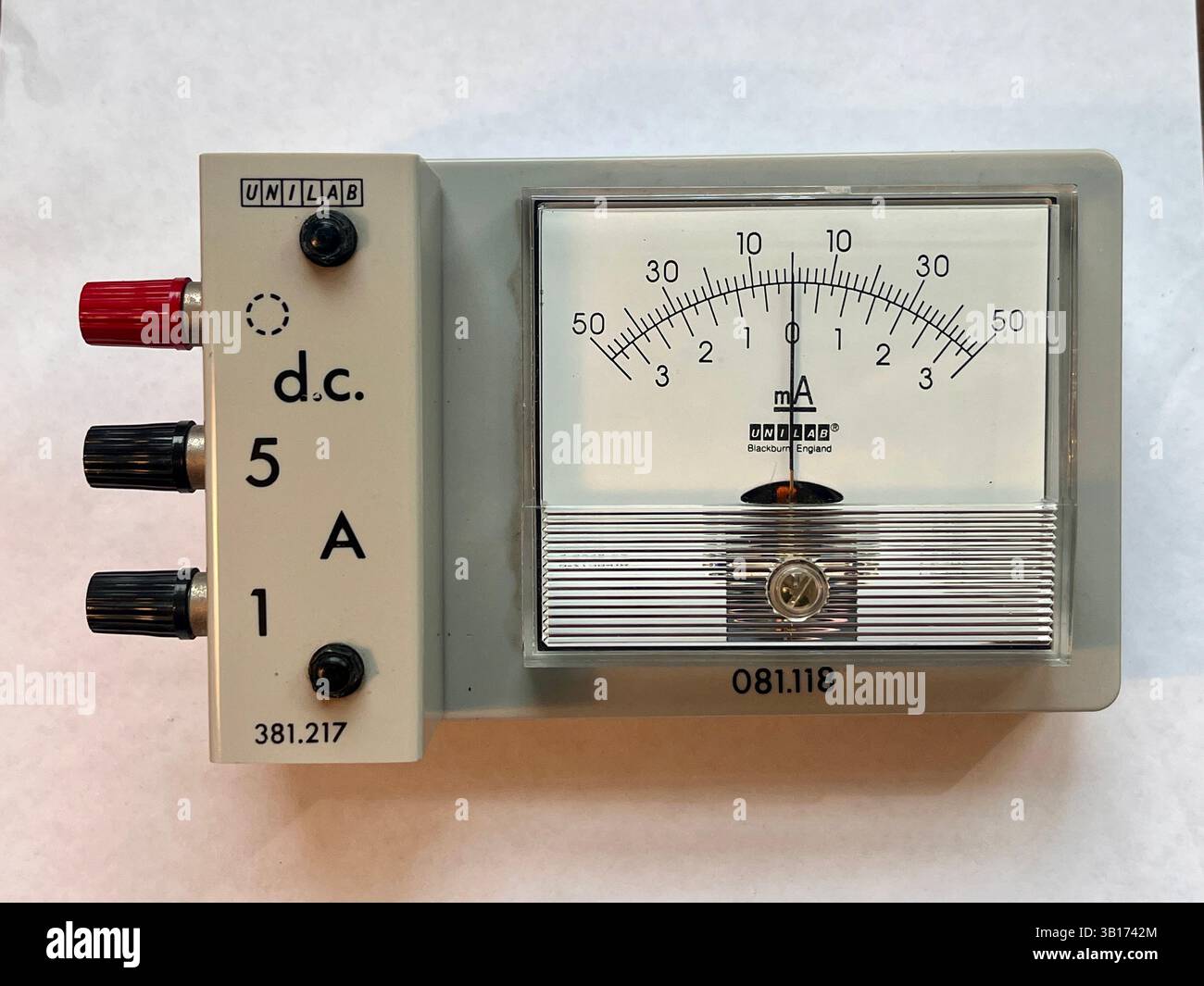 A light grey plastic moving coil analogue ammeter used in schools with ...