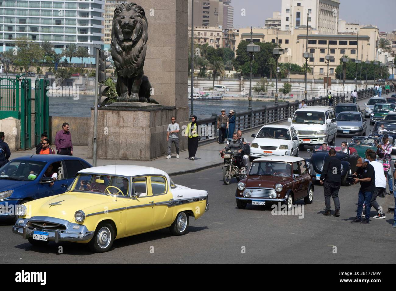 Vintage classic cars collectors parade on Qasr al-Nile Bridge during a show in Cairo, Egypt ...