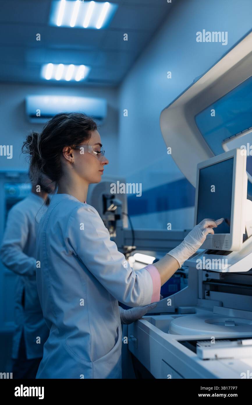Doctor using modern medical microscope hi-res stock photography and ...