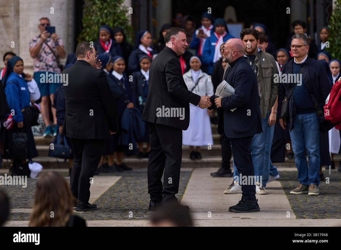 Cardinal Rolandas Makrickas, center, is welcomed upon his arrival at ...