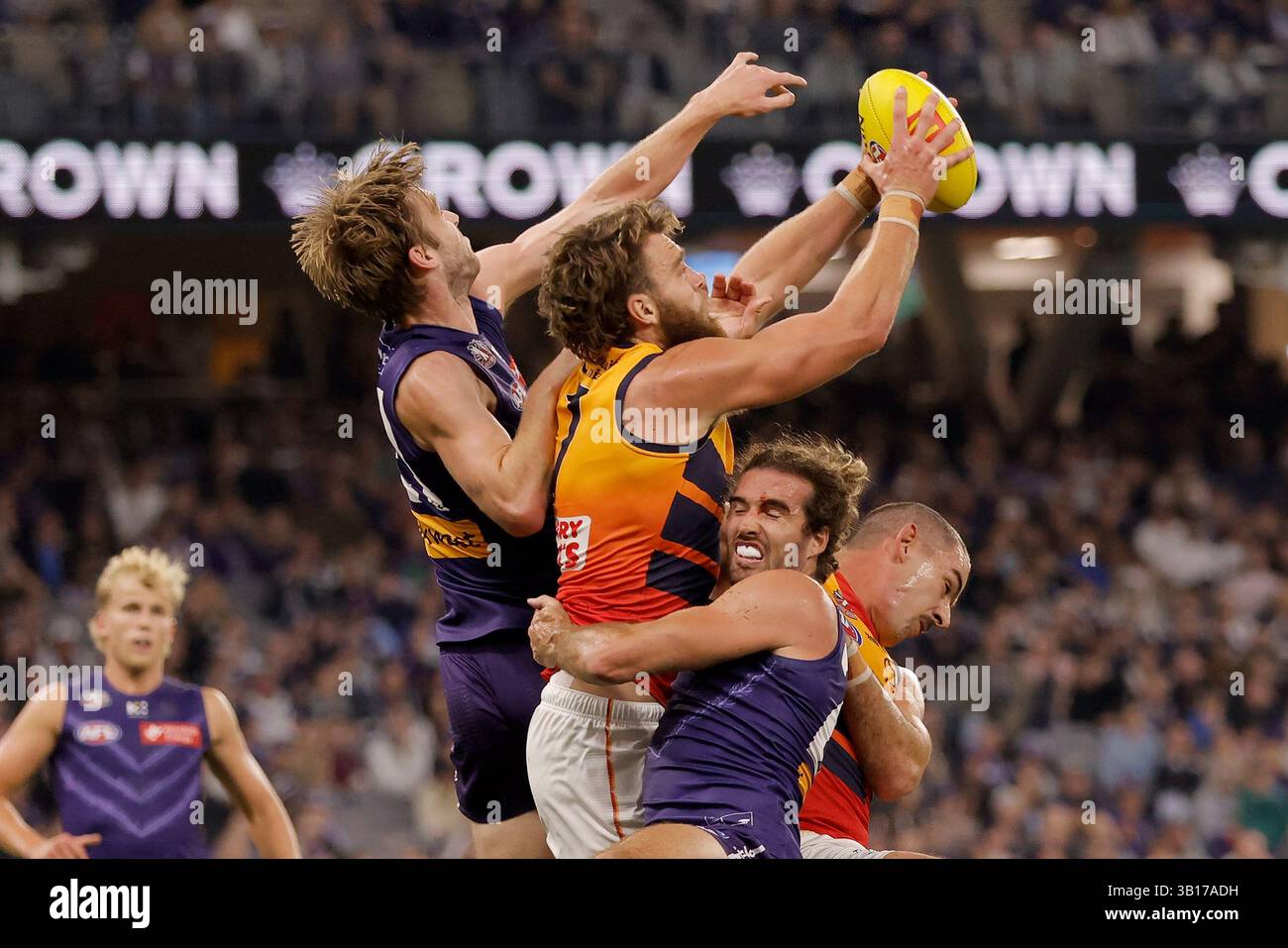 Perth, Australia. 25th Apr, 2025. Riley Thilthorpe of the Crows marks ...