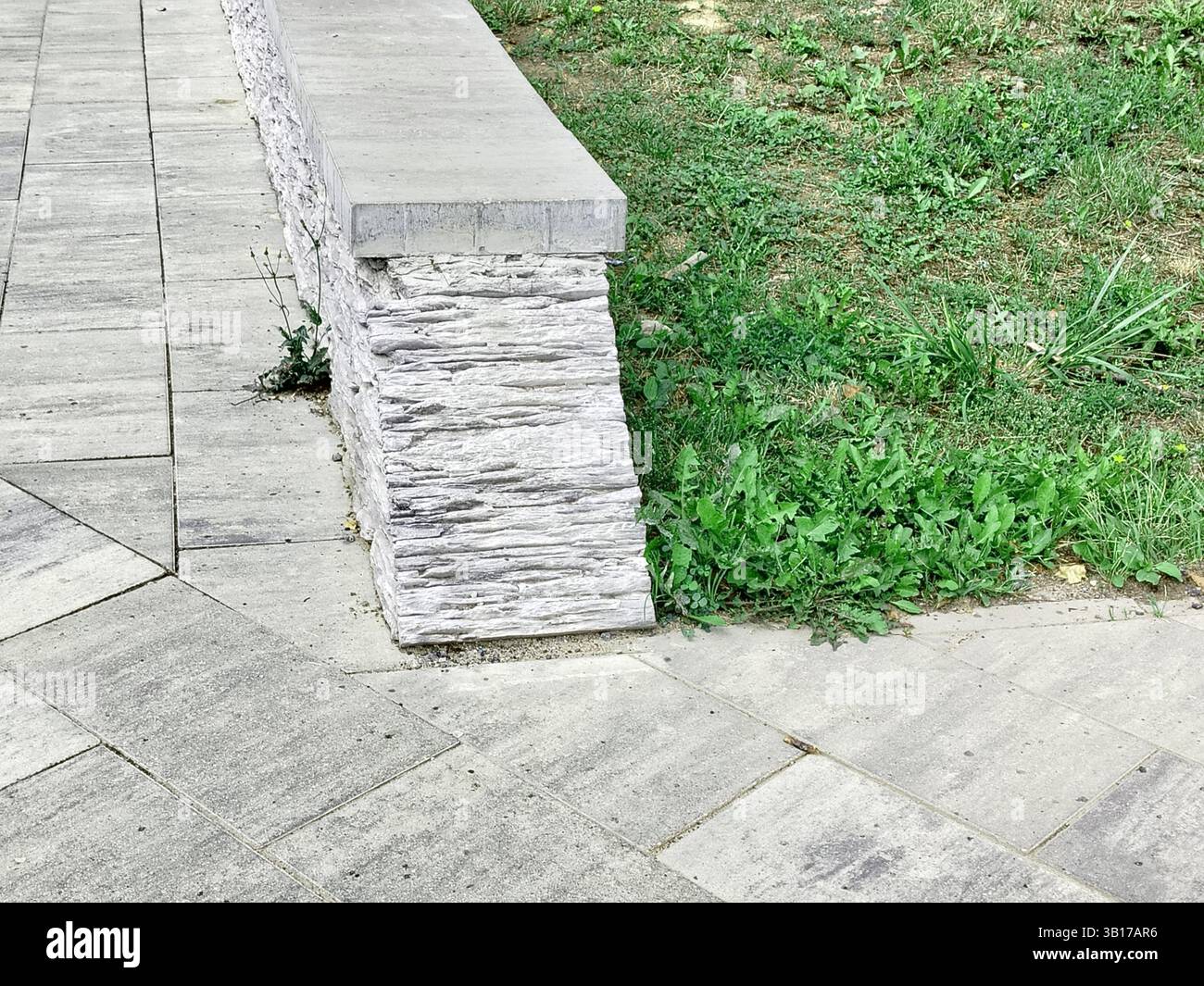 Paving tile with high fence in the form of a parapet, close-up Stock ...
