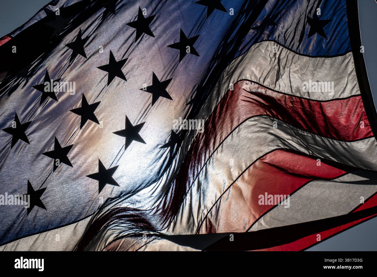 UNITED STATES — Detail of the American flag backlit by the sun ...