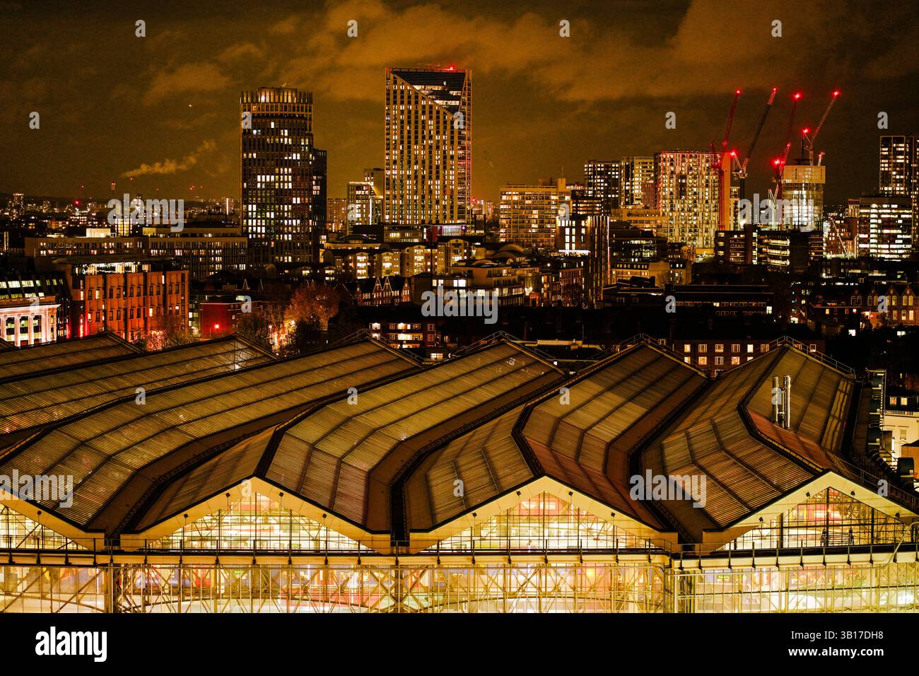 Illuminated rooftops of London's Waterloo Station at night, with the ...