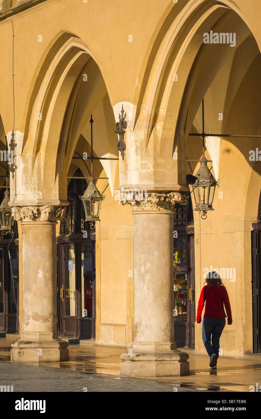 Young woman walking, rear view of a young female walking alone in a ...