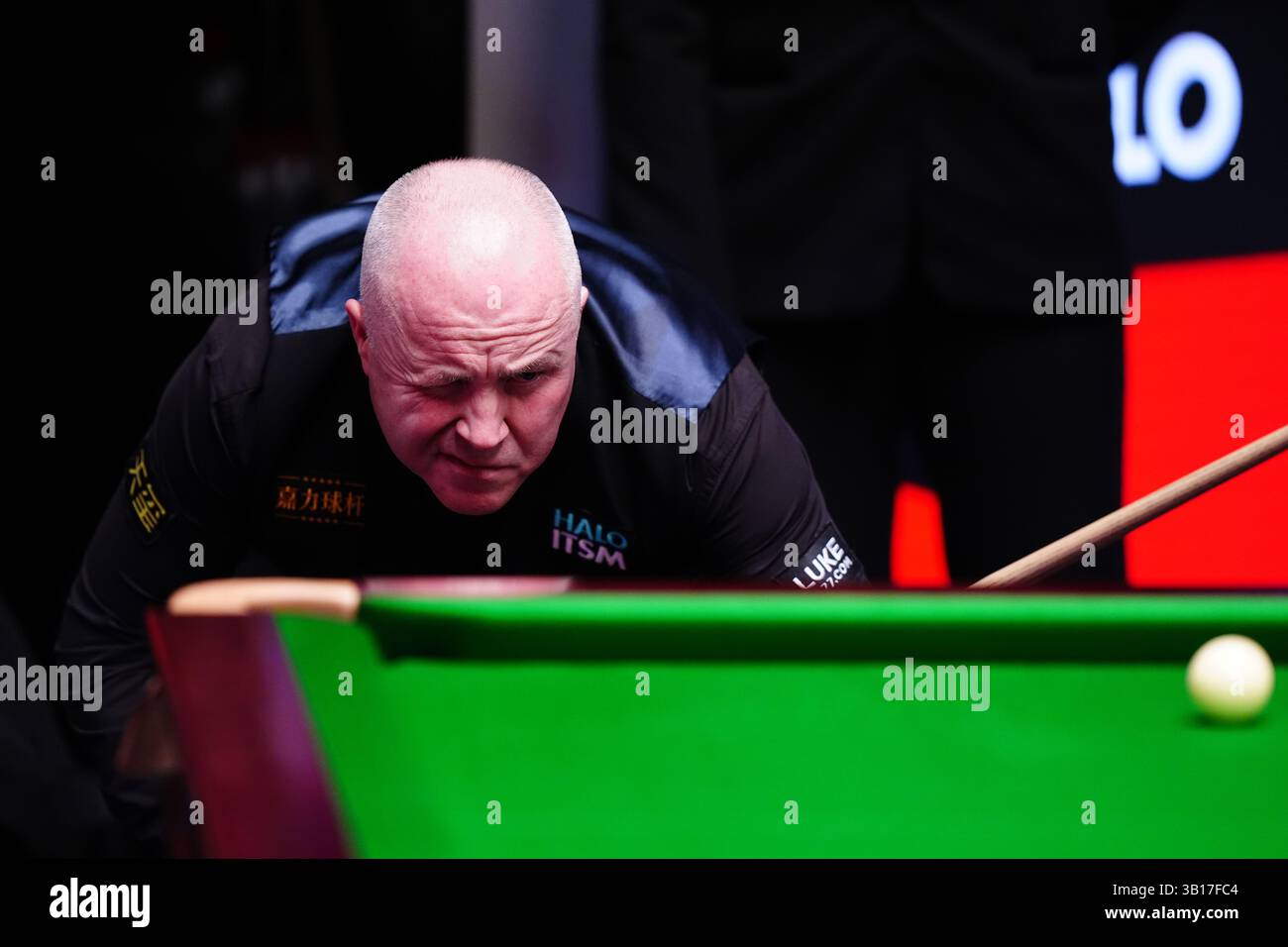 John Higgins during his match against Xiao Guodong (not pictured) on ...