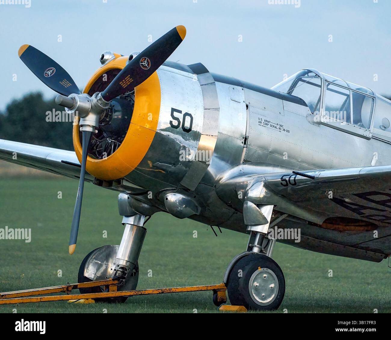 A gleaming silver and yellow Fairchild PT-19, a World War II-era American primary trainer ...