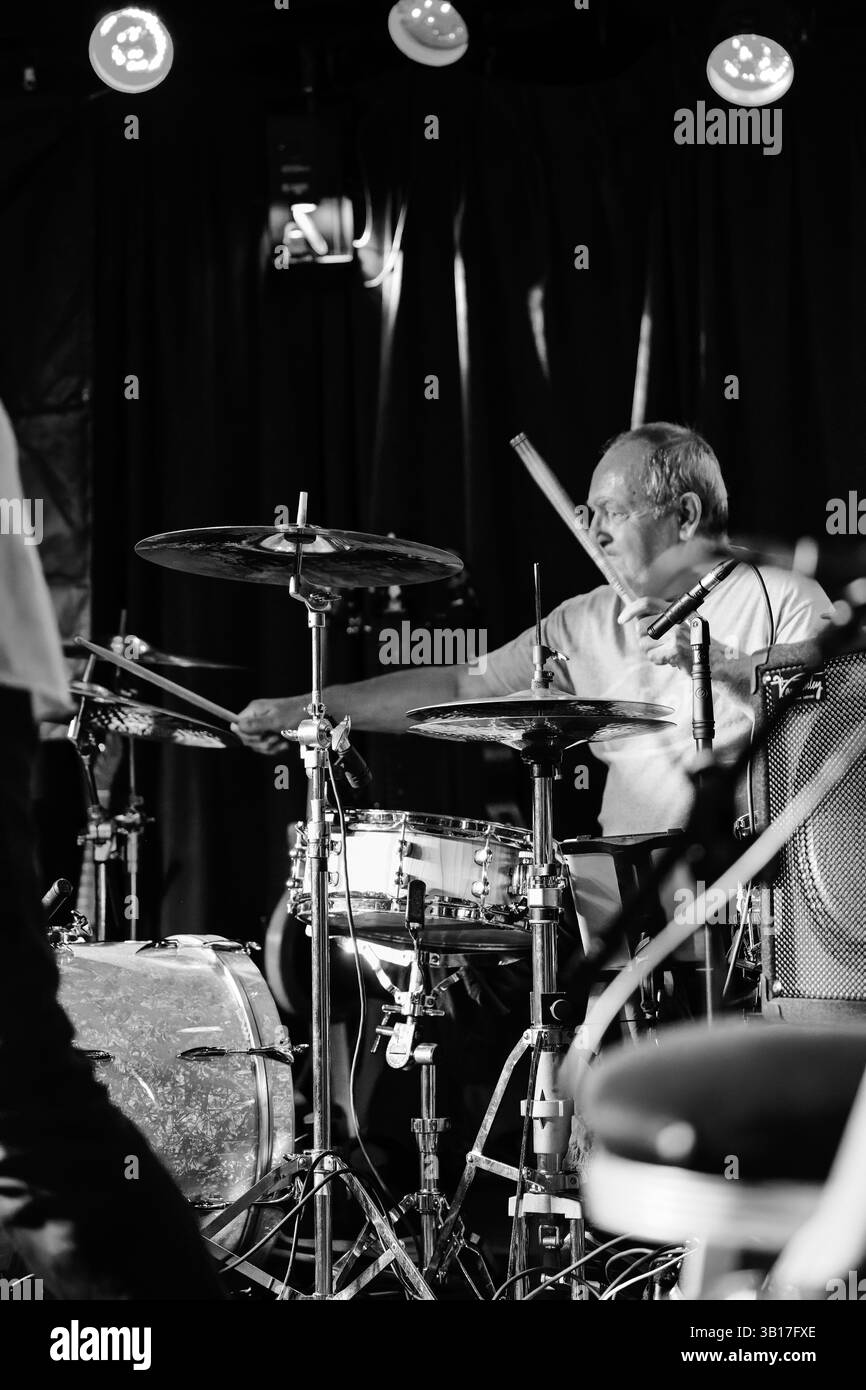 Drummer plays on dark stage hi-res stock photography and images - Alamy