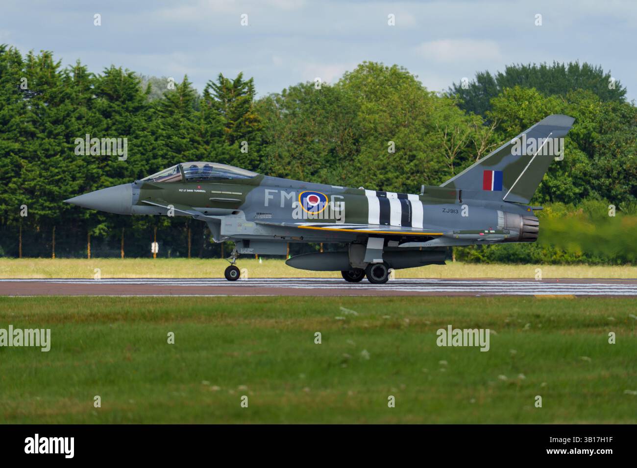 A Royal Air Force Eurofighter Typhoon sporting a D-Day striped livery ...