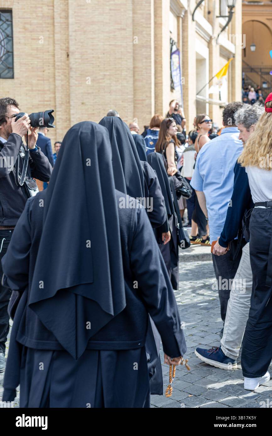 Vatican - April, 23, 2025: Nuns walk through crowd with pilgrims and ...