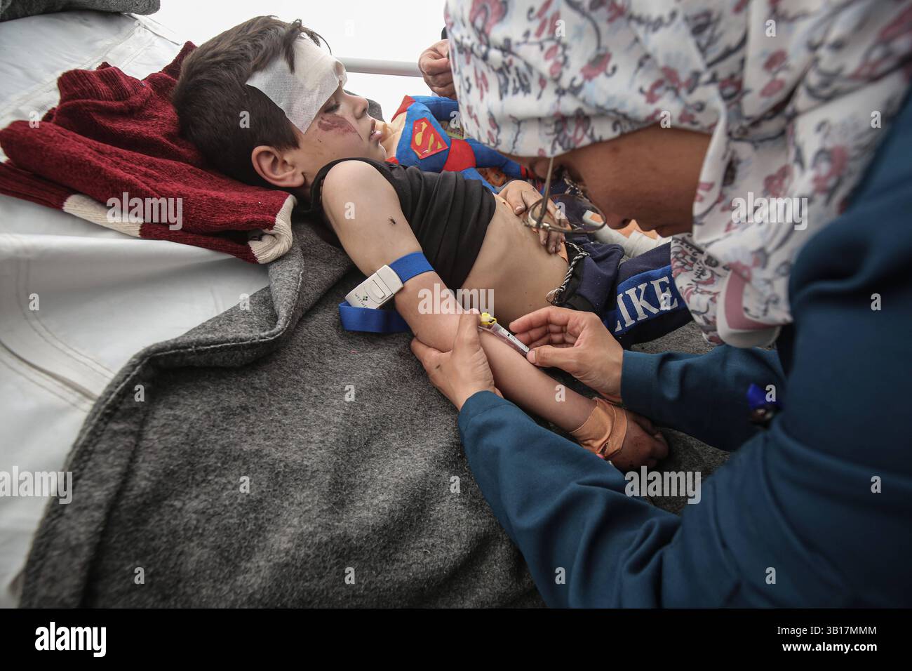 A Palestinian child, Ali Faraj, 7, the only survivor of the attack, is ...