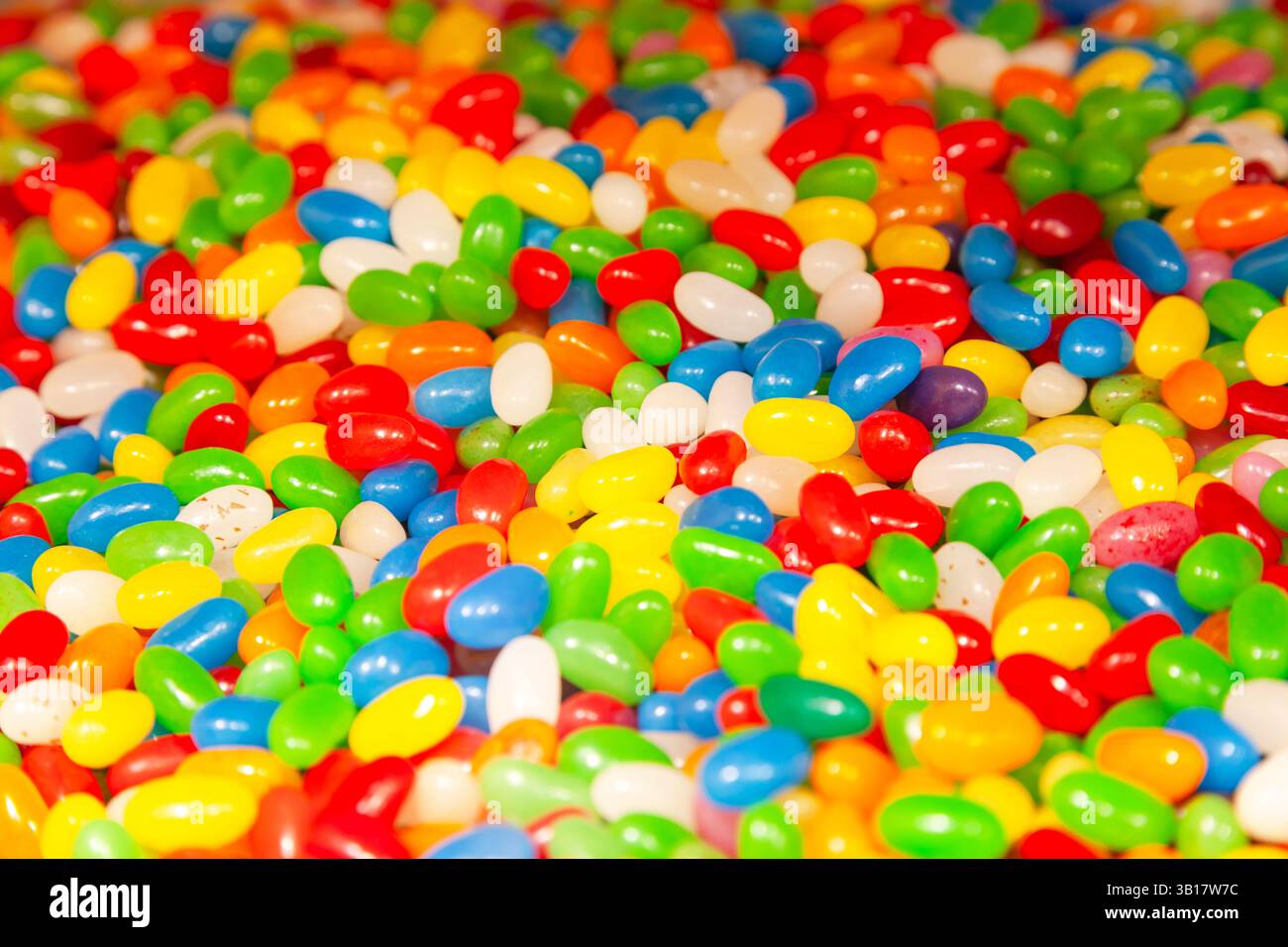 Background from a pile of oval candies in multi-colored glaze Stock ...