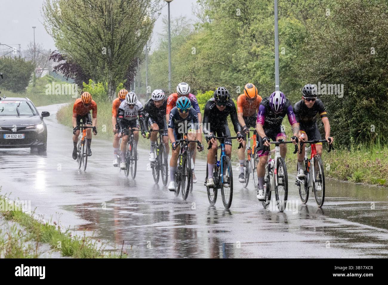 Oviedo, Spain. 25th April 2025. A group of cyclists straggling behind ...