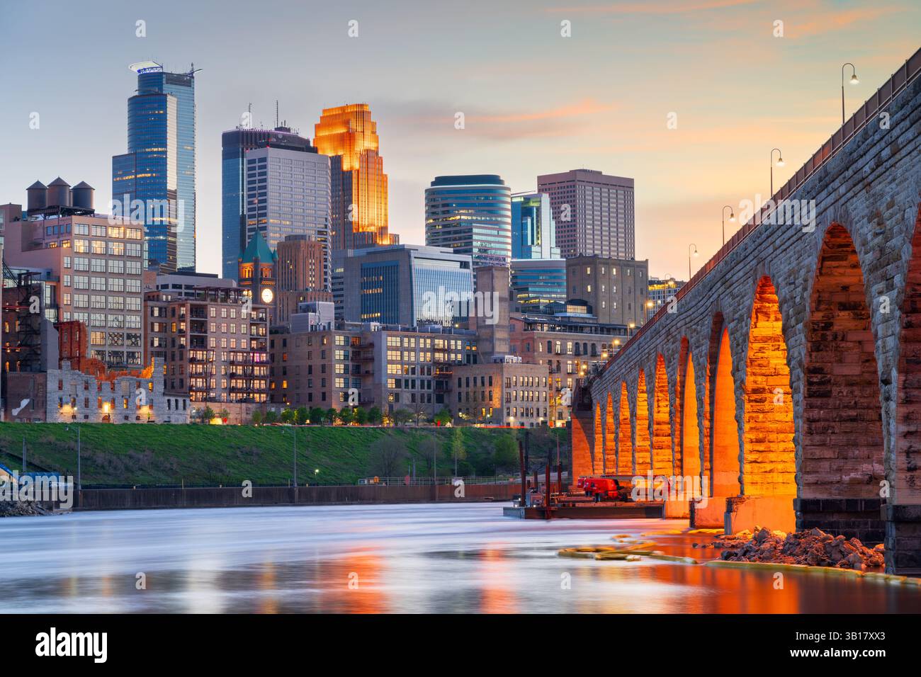 Minneapolis, Minnesota, USA skyline with the Stone Arch Bridge on the ...