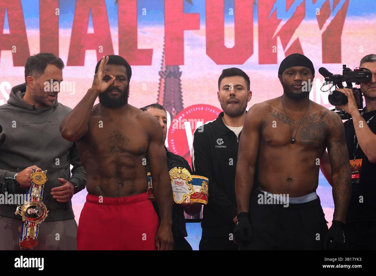 Cheavon Clarke (left) and Viddal Riley face off during the weigh in at ...