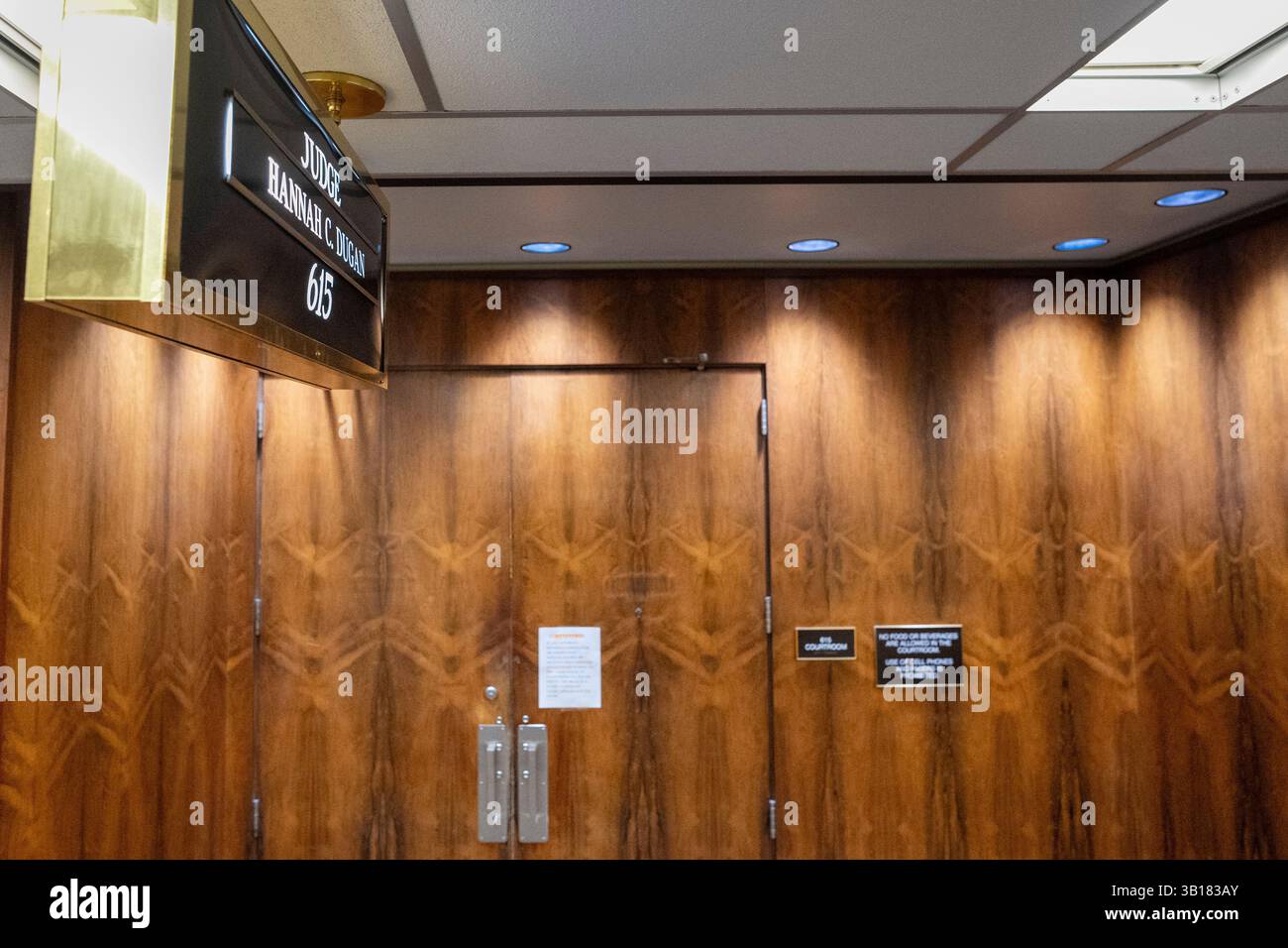 A sign is posted on the doors of Judge Hannah Dugan courtroom Friday ...